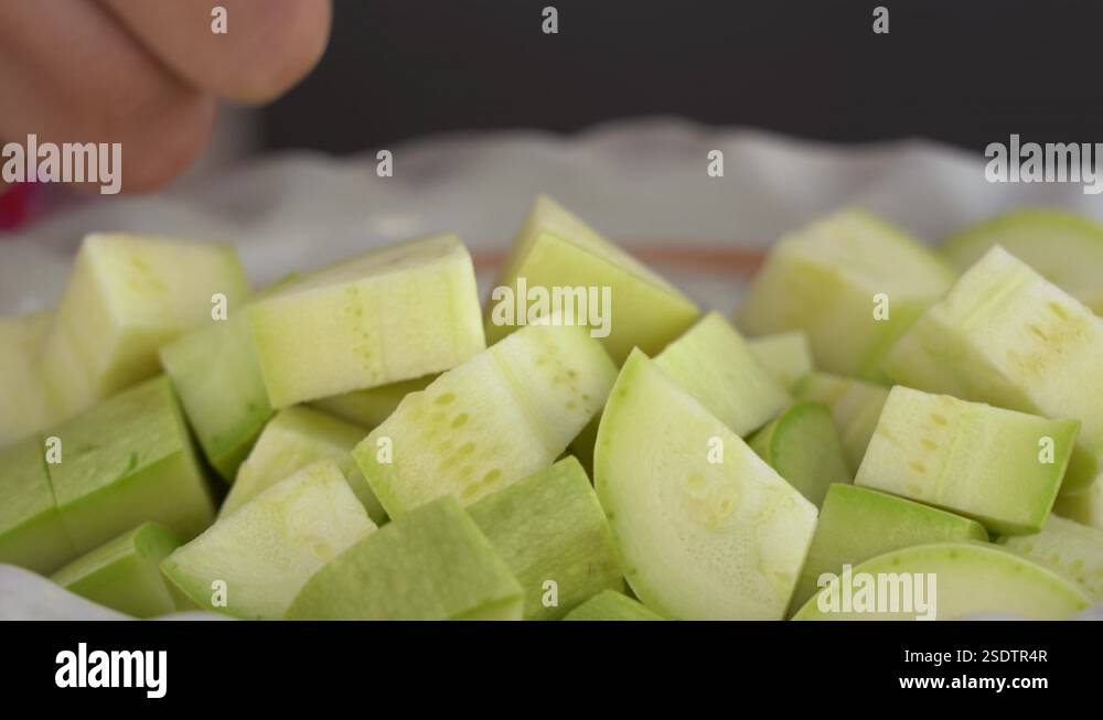 Woman cutting fresh organic young squash vegetables Stock Video Footage ...