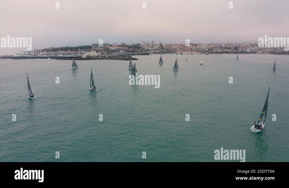 Sailboats Line Up Sailing Near Marina de Cascais Portugal - aerial shot ...