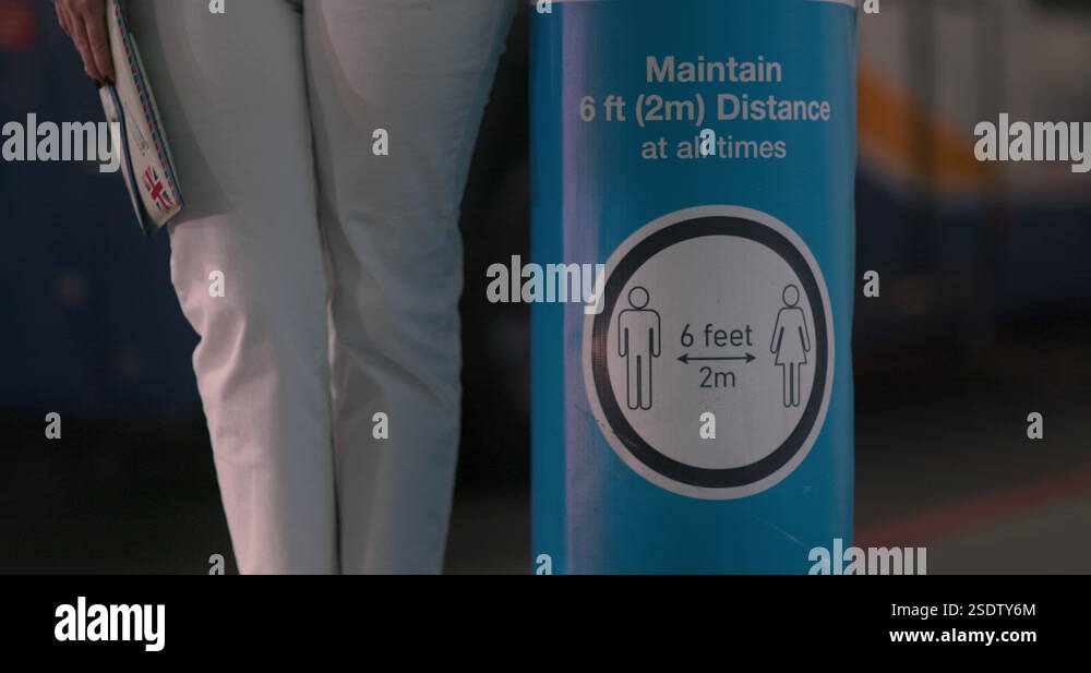 COVID-19 sign at airport terminal reminding to keep social distance, 4K ...