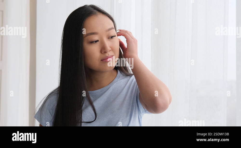 Beautiful woman looking out through window Stock Video Footage - Alamy
