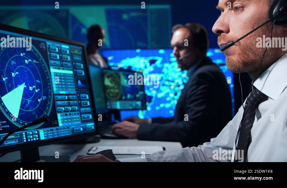 Workplace of the air traffic controllers in the control tower. Team of ...