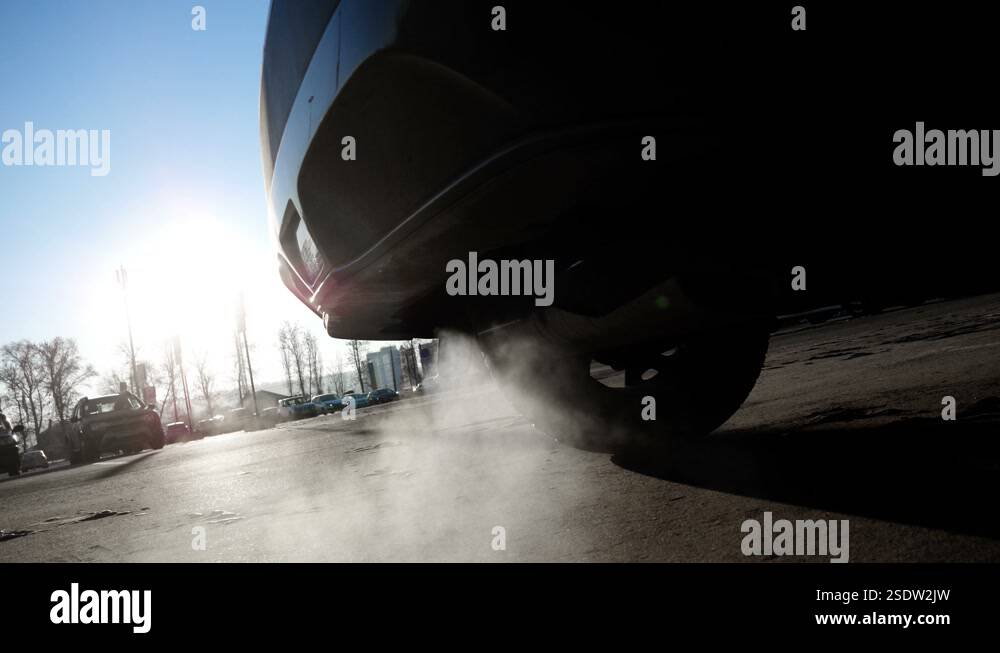 Smoke emissions fumes from car exhaust tailpipe causing air pollution ...