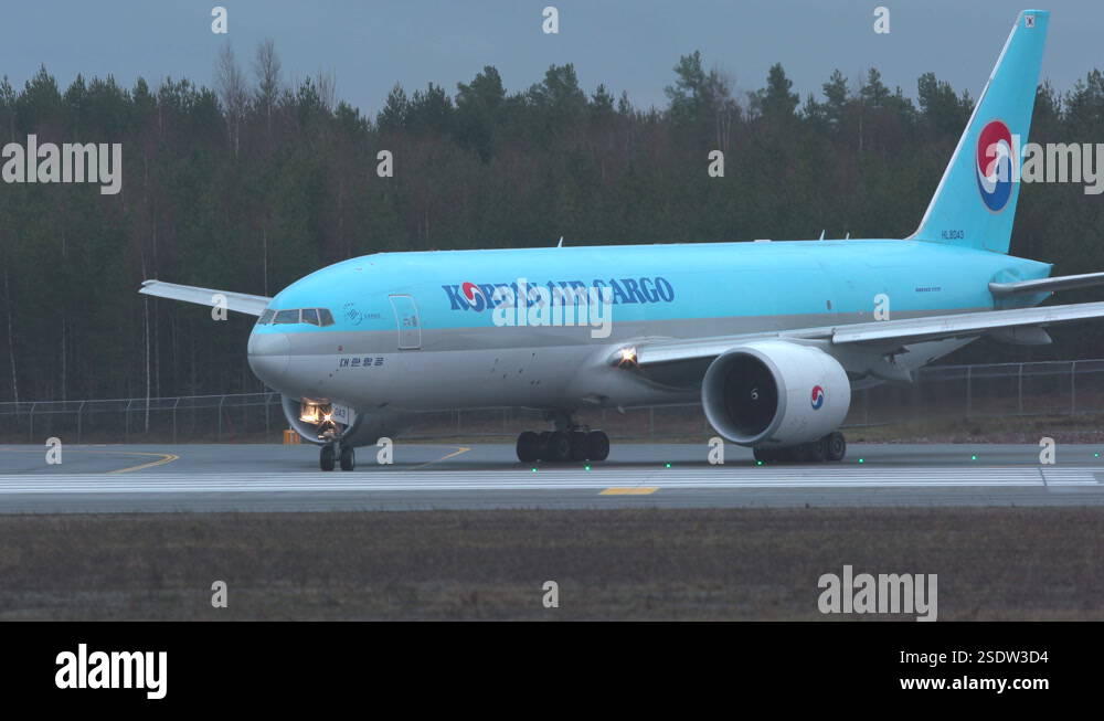 huge cargo airplane korean air boeing 777 taxiing turning slow forward ...