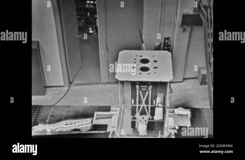 1960s: Room in NASA Goddard Space Flight Center laboratory. Two men ...