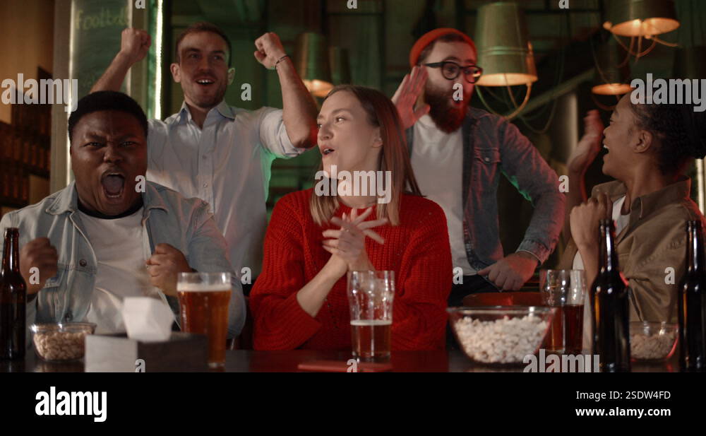 Excited young people doing wave, clapping and giving high five while ...