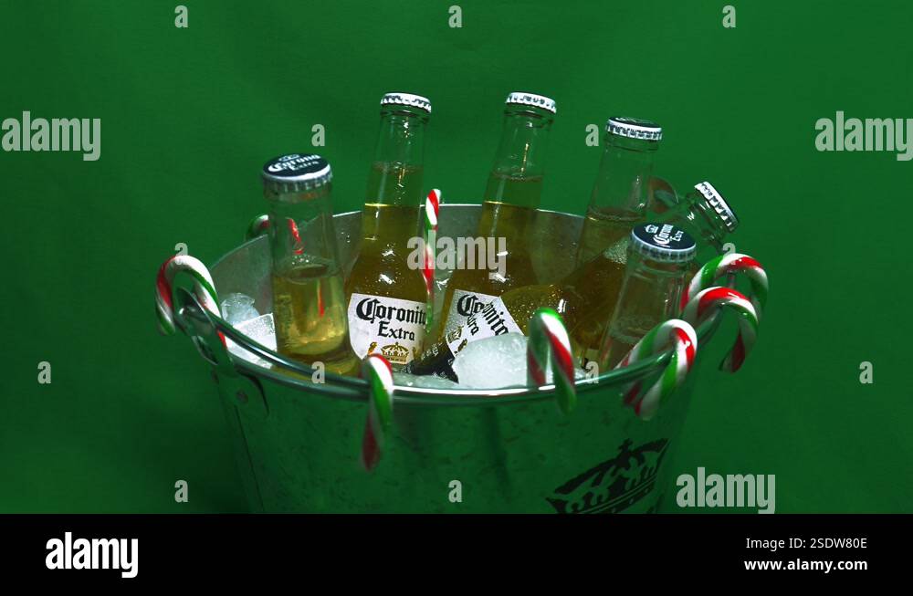 rotating green screen iced glass bottles capped with corna extra ...