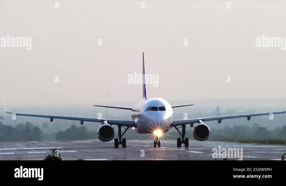 Airplane moving on the runway preparing for take off. Airbus A320 taxi ...