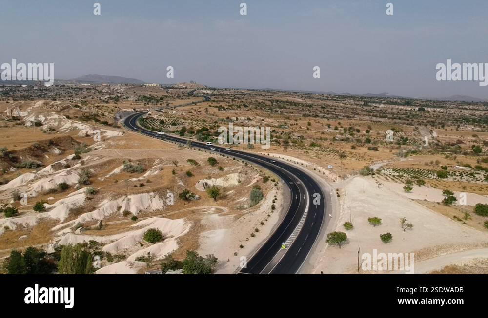 Cappadocia Turkey desert sandy road sunny terrain curved highway aerial ...