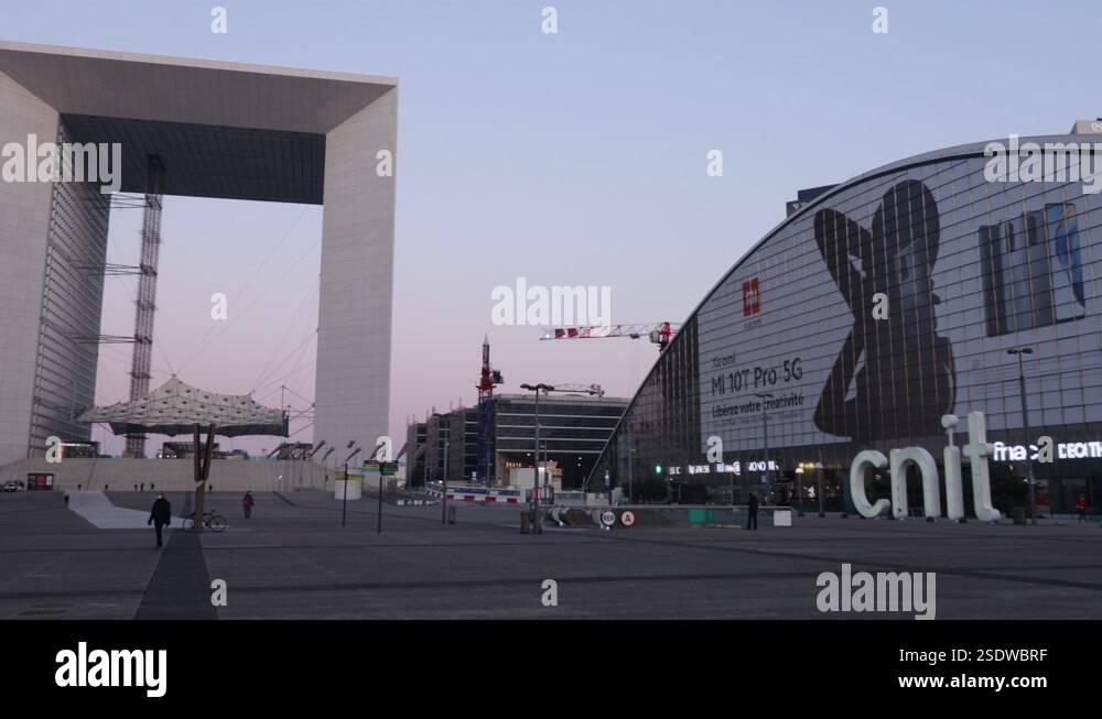 La Defense Plaza during early morning with few people, the Great Arch ...