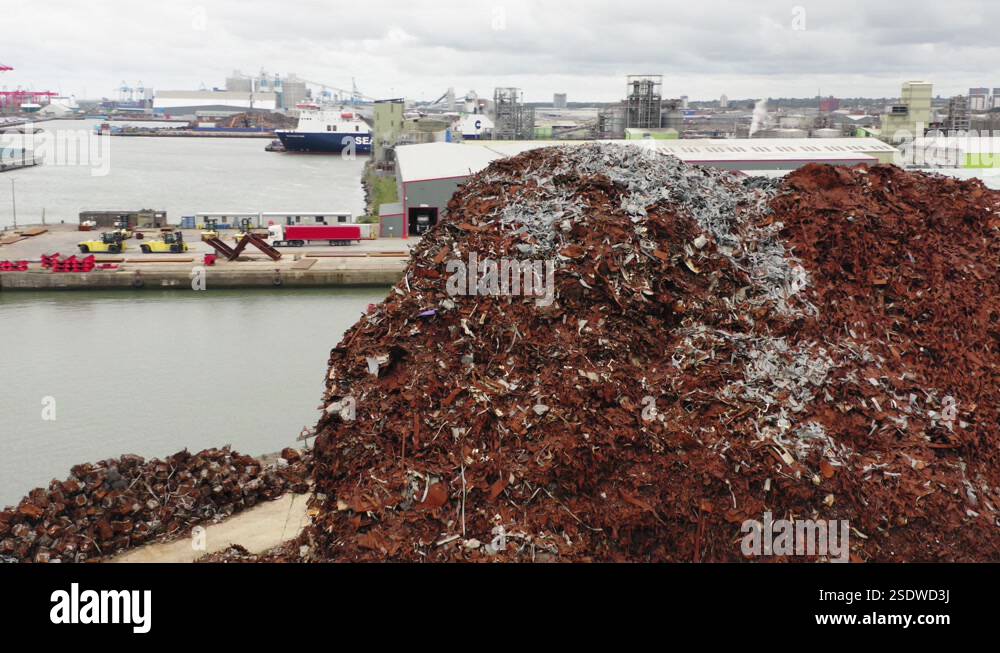 Large pile of scrape steel located on a dock yard in the UK. Industrial ...