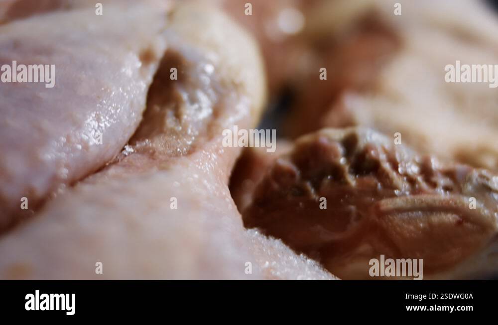 Macro view of a box full of frozen chicken legs. Frozen raw chicken ...