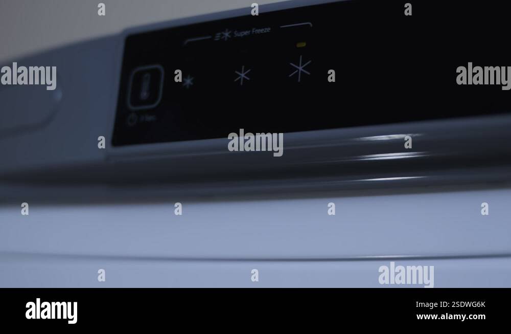 Electronic control on a touch panel of a freezer. Alert indicator ...