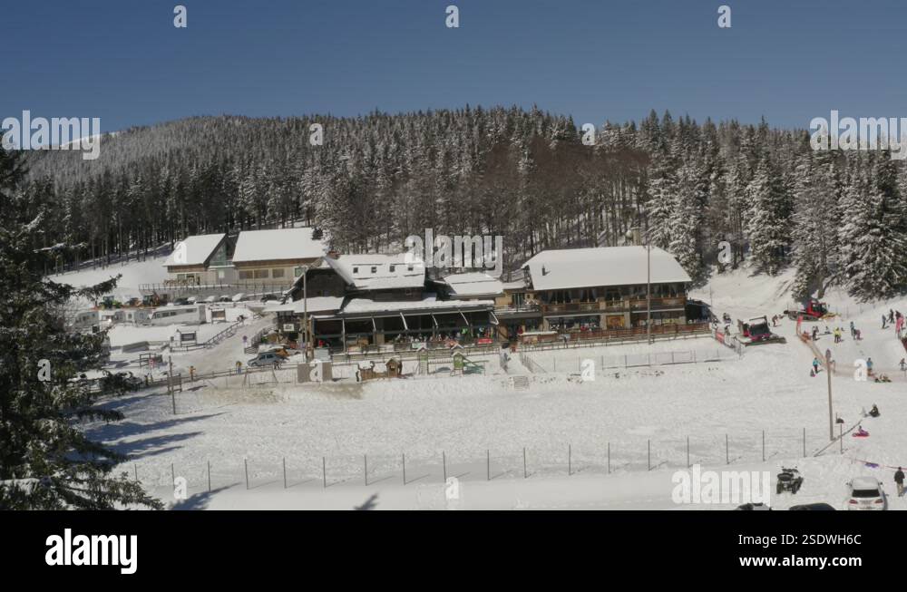 Kope ski resort complex in the Pohorje mountains revealed behind snowed ...