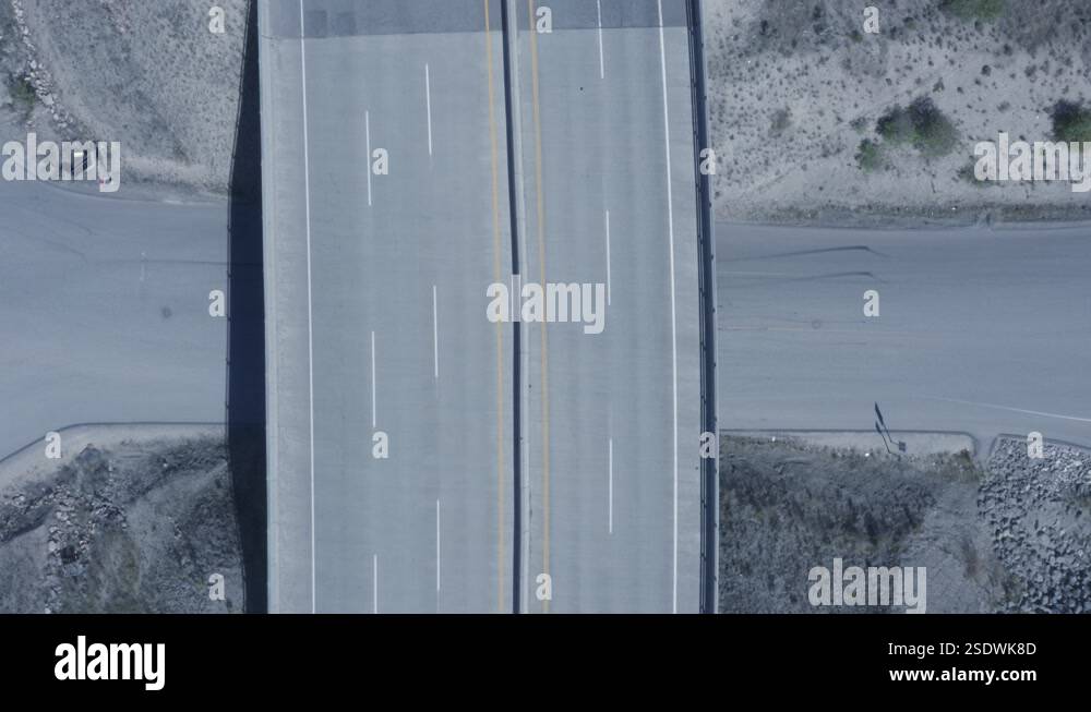 aerial hold over dessert overpass five lane freeway interstate and an ...
