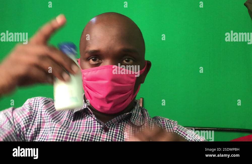 Baldness swarthy man with red face mask pouring fake vaccine for Stock ...