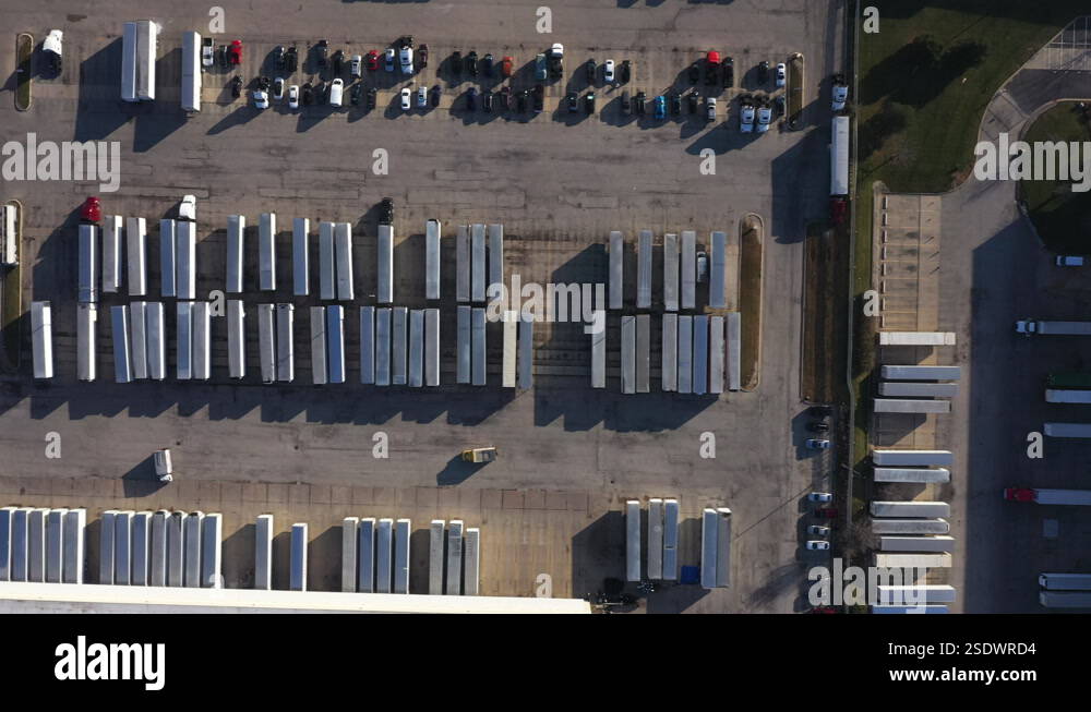 parking area with lush truck containers and cars in carriers company ...