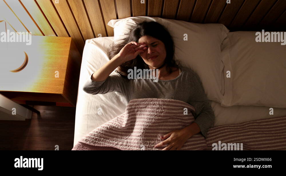 Worried woman unable to sleep suffering from insomnia. Person tossing ...