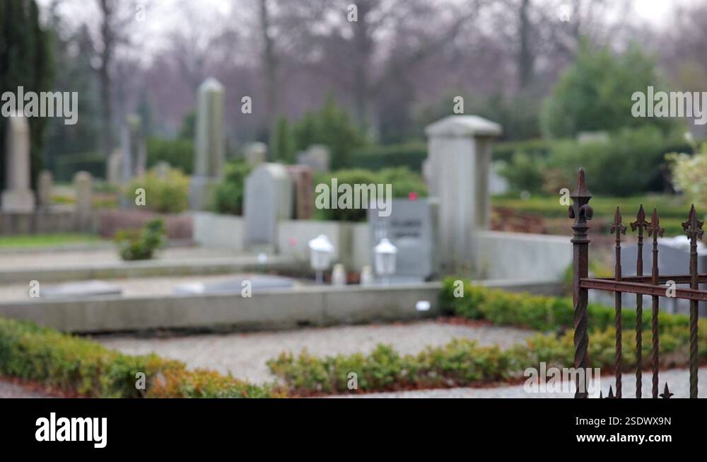 Cemetery with focus on Cemetery railing. Background out of focus Stock ...