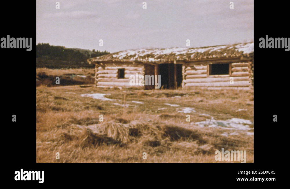 1970s: Empty log cabin on prairie. Empty house on prairie. Cemetery on ...