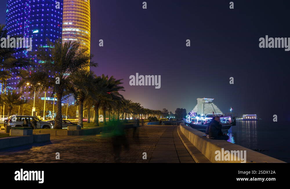The skyline of Doha by night with starry sky seen from Corniche ...