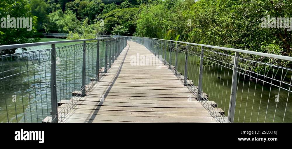 Walking Along The Scenic Coastal Boardwalk At Chek Jawa Wetlands In ...