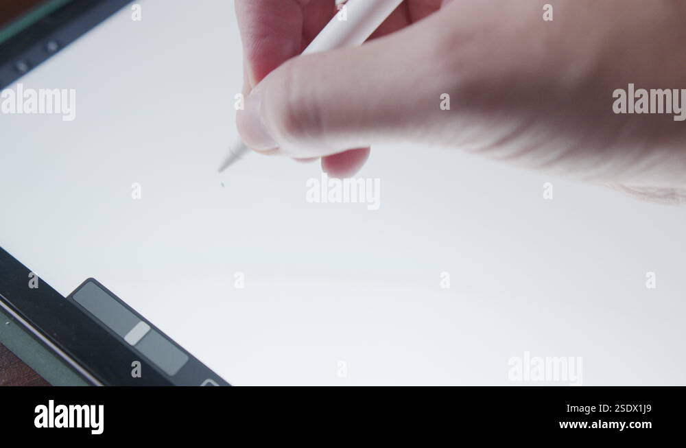 Close Up of a Man Digitally Drawing a Wavy Line on a Touchpad Screen ...