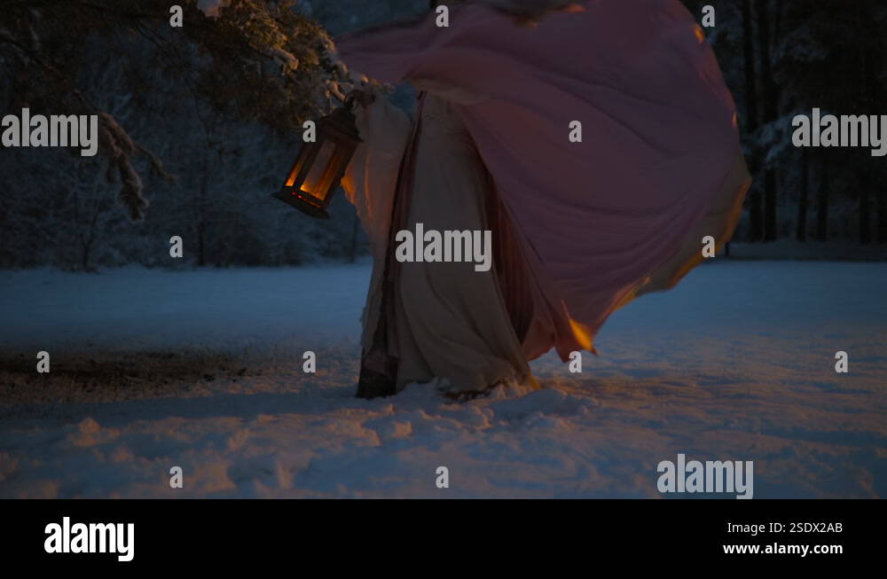 Epic fantasy shot: Young woman spinning her flying cloak holding ...