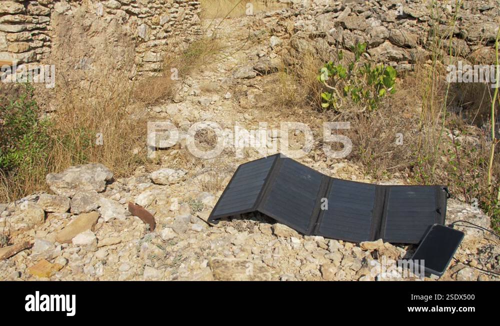 Mobile charging by Solar Panel. Hand disconnect the Cable from the ...