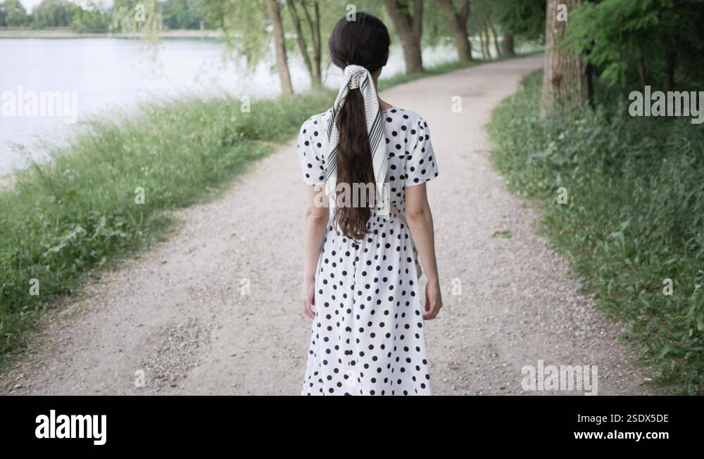 Back view young woman walks Stock Videos & Footage - HD and 4K Video ...