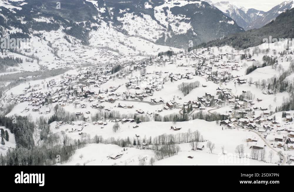 Drone Aerial view of the snowy Grindelwald and the Eiger in the ...