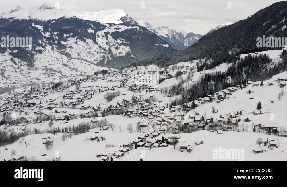 Drone Aerial view of the snowy Grindelwald and the Eiger in the ...