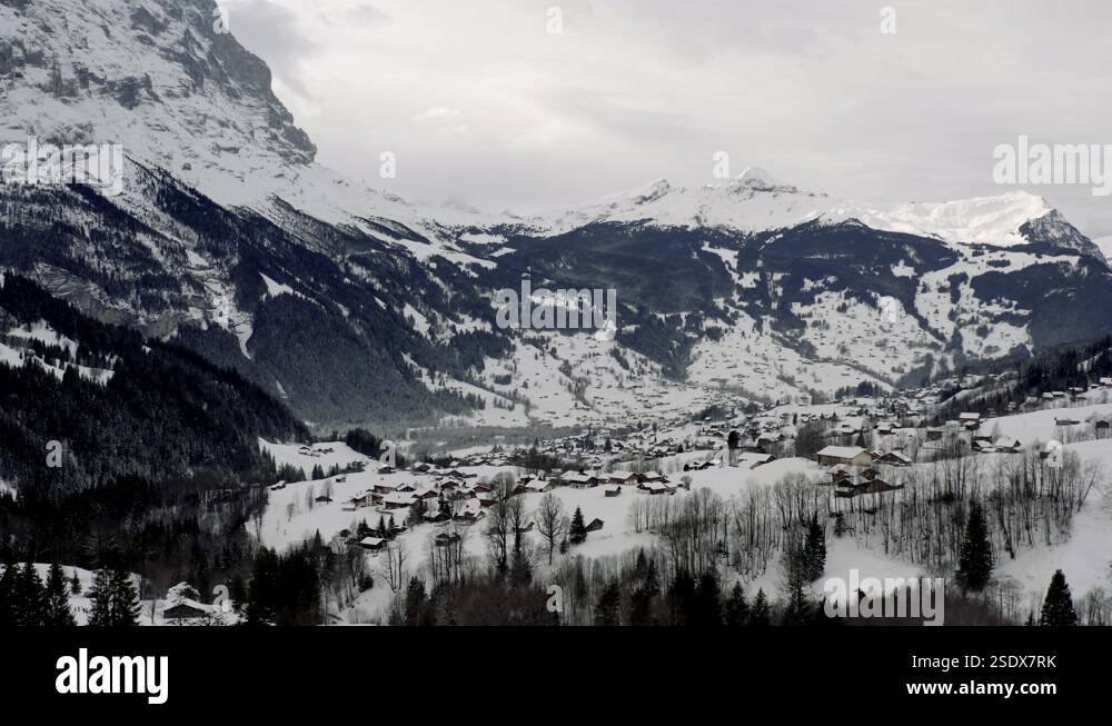 Drone Aerial view of the snowy Grindelwald and the Eiger in the ...