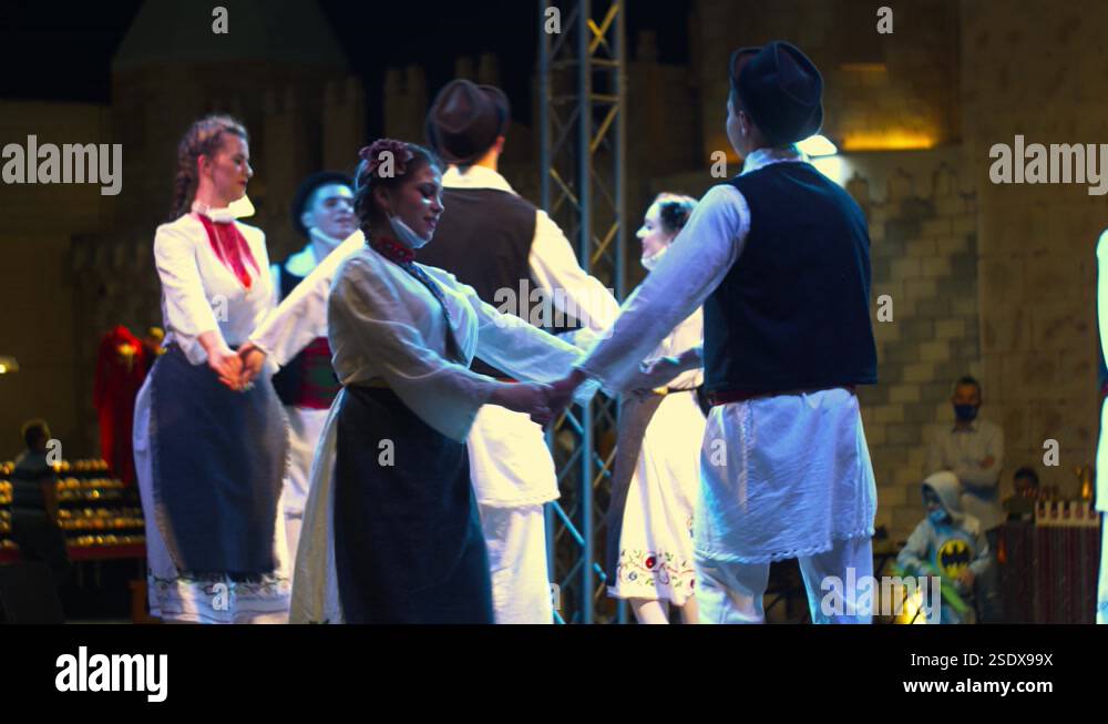 Group dance holding hands. Balkan dance. Kolo dance performance on ...
