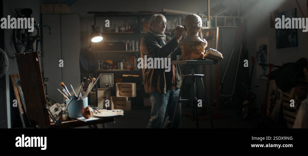 Senior middle eastern male sculptor working on a bust project in his workshop Stock Video ...