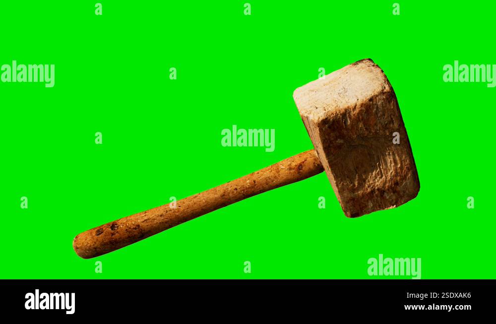 Old wooden mallet at green chromakey background Stock Video Footage - Alamy