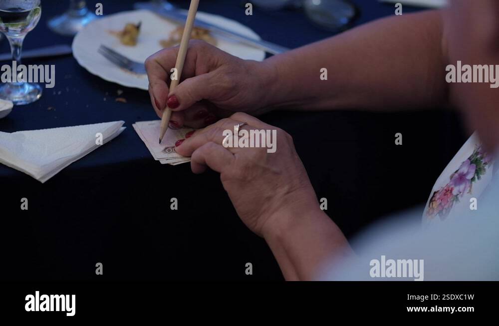 female old hands write on a piece of paper Stock Video Footage - Alamy