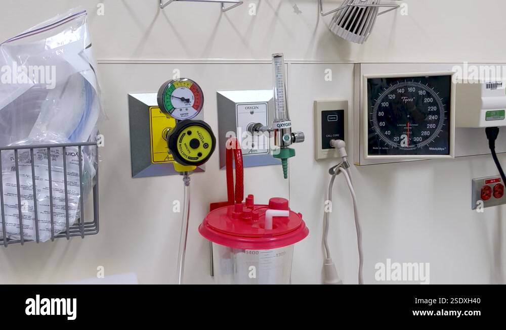 Slow pan right of medical equipment hanging on the wall of a hospital ...