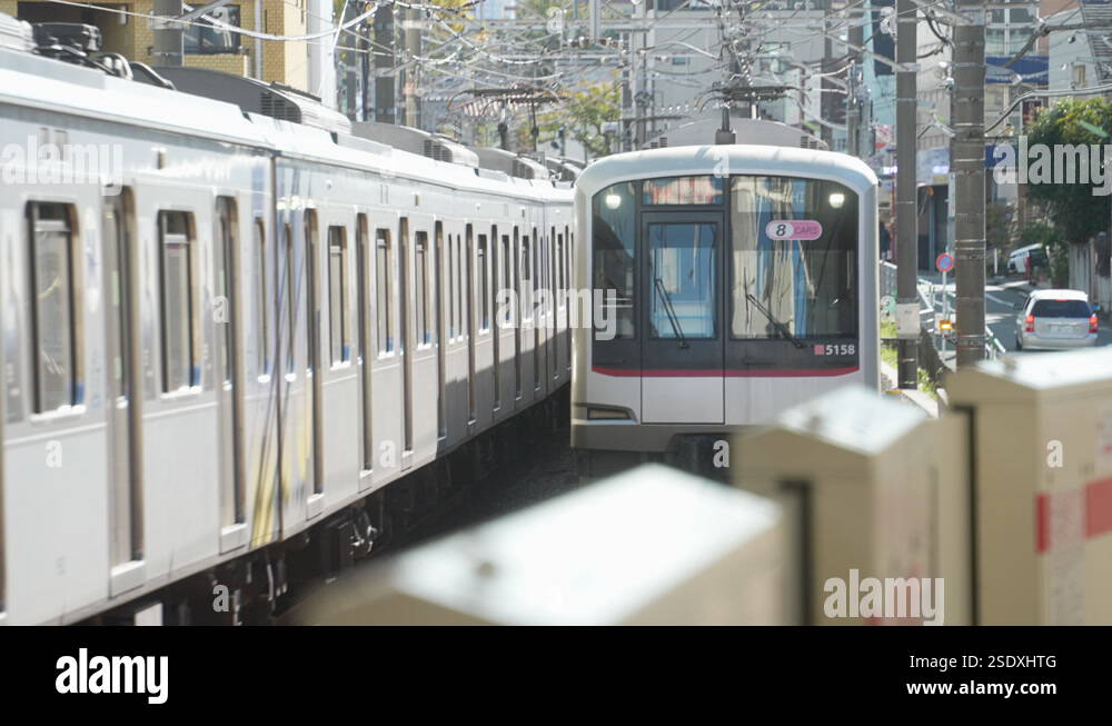Two Trains Meet On Railroad Track Near Station In Tokyo, Japan - JR Train Stock Video Footage ...
