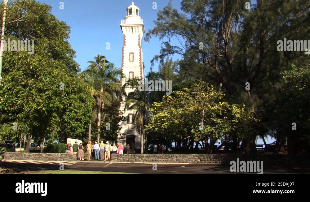 Tourists visiting The Point Venus and its lighthouse in Papeete, Tahiti ...