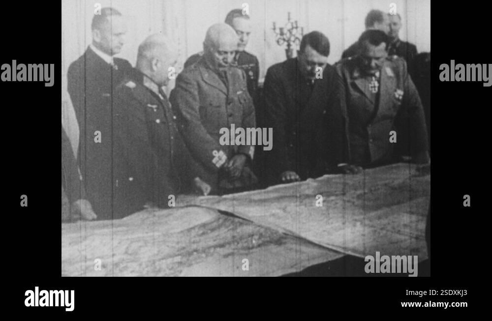 1930s: Hitler and men look at maps. People walk among the rubble. Blast ...