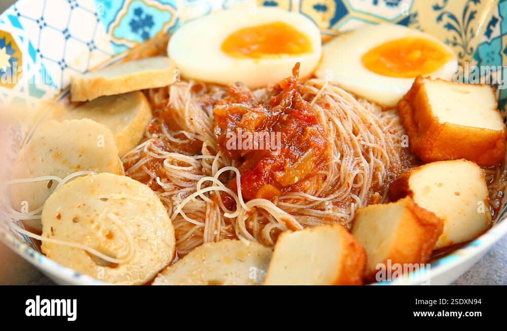 Grass noodles with spicy soup or Mee Siam, Malasian famous food Stock ...