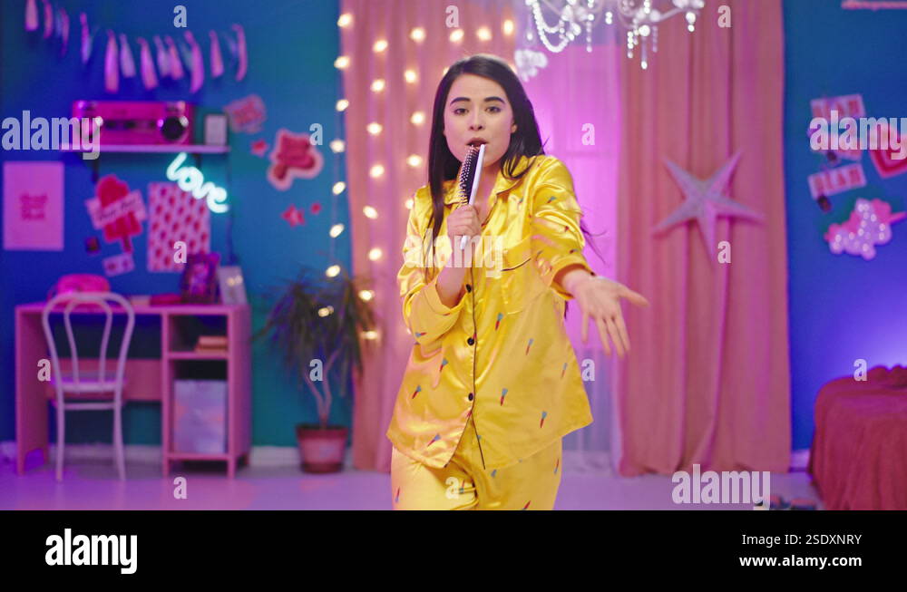 Amazing lady in a pretty pajamas have a good time in her room she ...