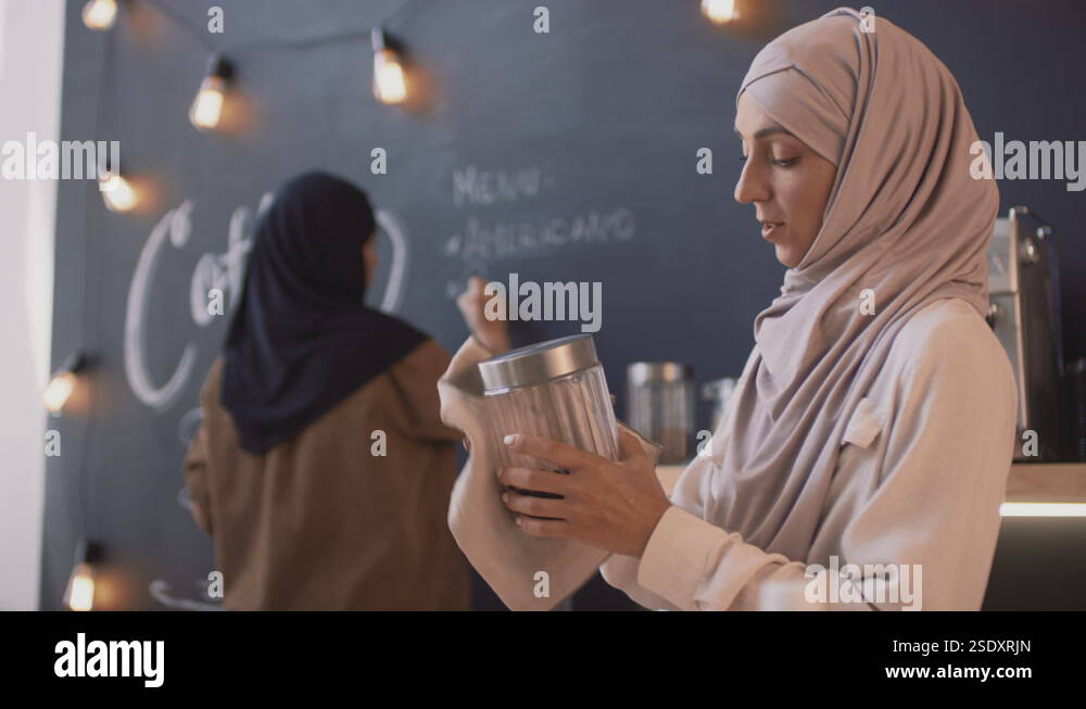 Muslim Women Preparing Coffeeshop For Opening Stock Video Footage - Alamy