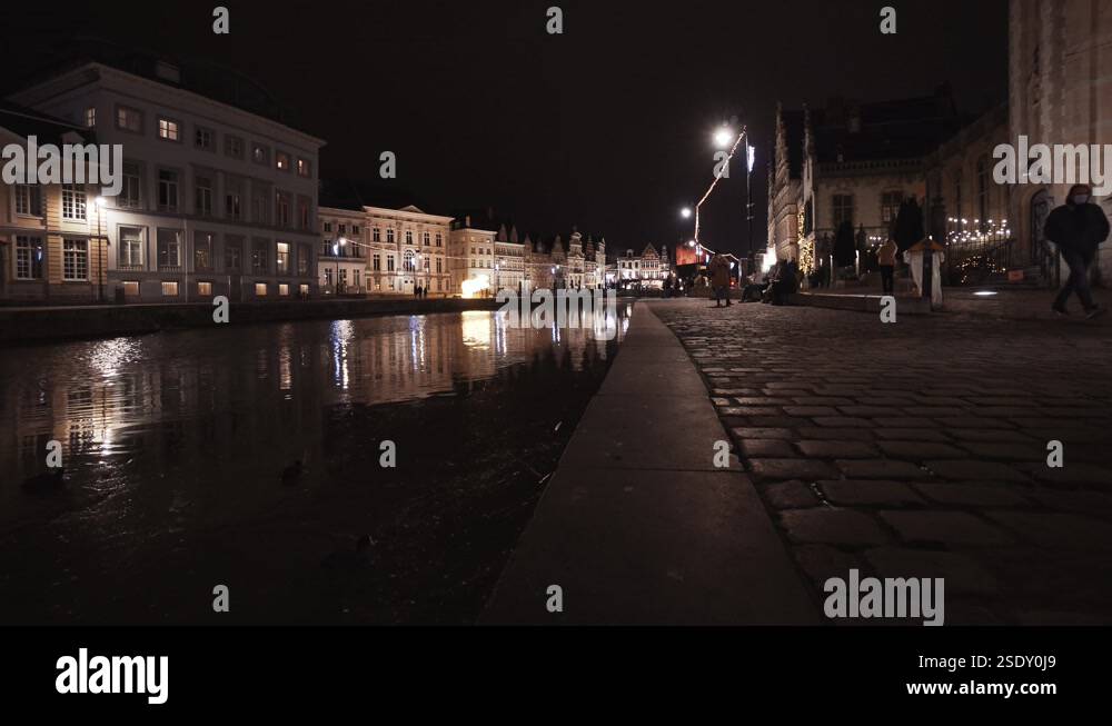 Static low angle from Graslei of Leie River with lantern reflection in ...
