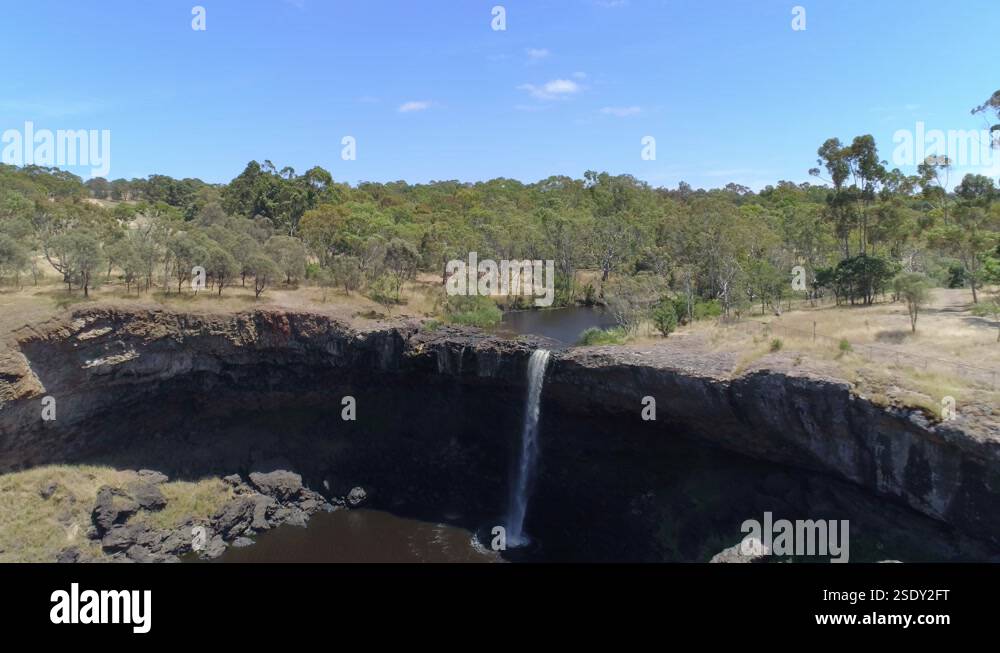 Forward flight toward Wannon Falls and trees in Victoria, Australia ...