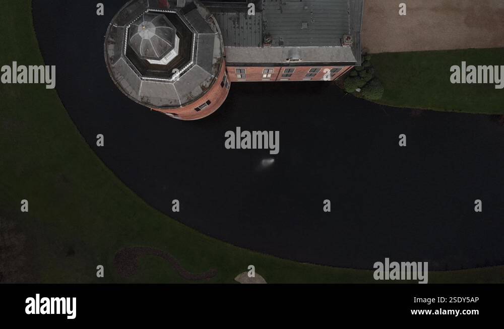 Top down rooftop view of moated Rosendael castle aerial descend ...