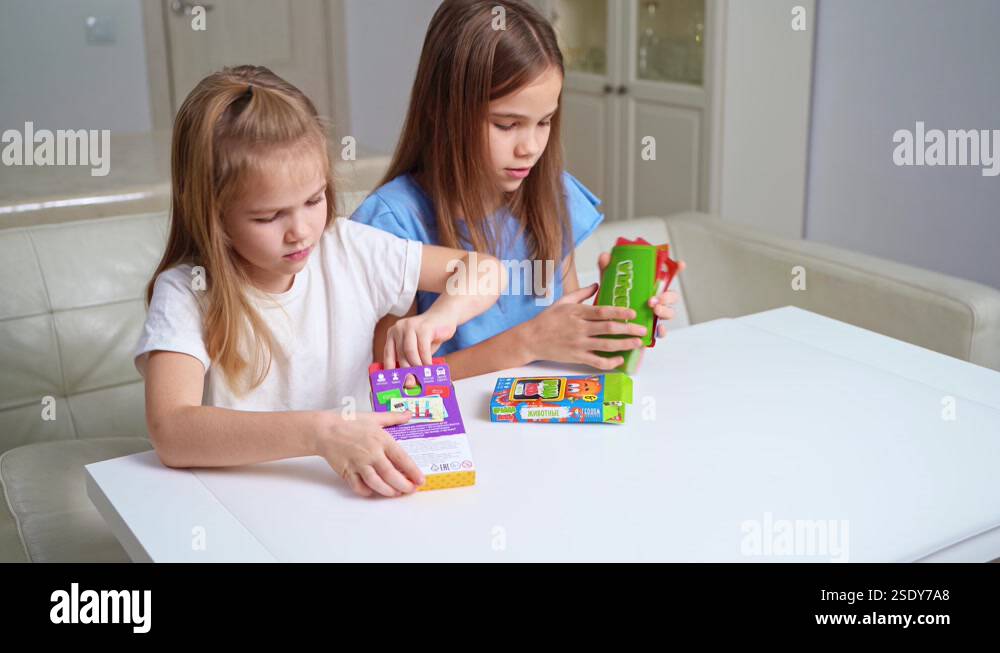 girls unpack with new development and training cards. board games for ...