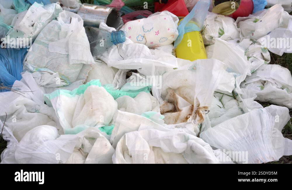 Dirty baby diapers in the landfill. Environmental Impact of Used ...