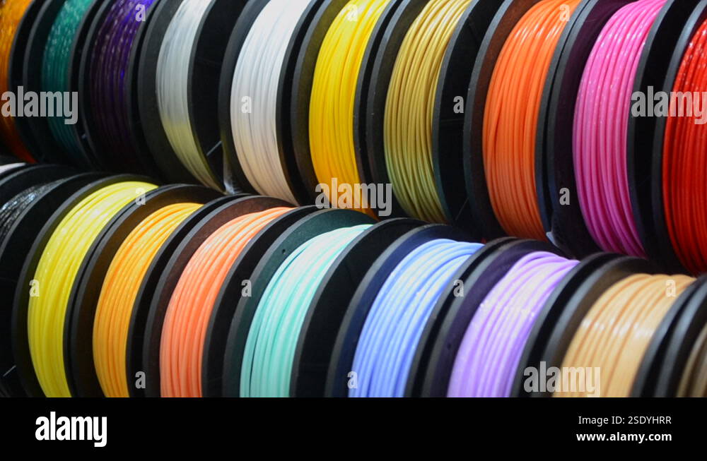 Multicolored filaments of plastic for printing on a 3D printer close-up ...