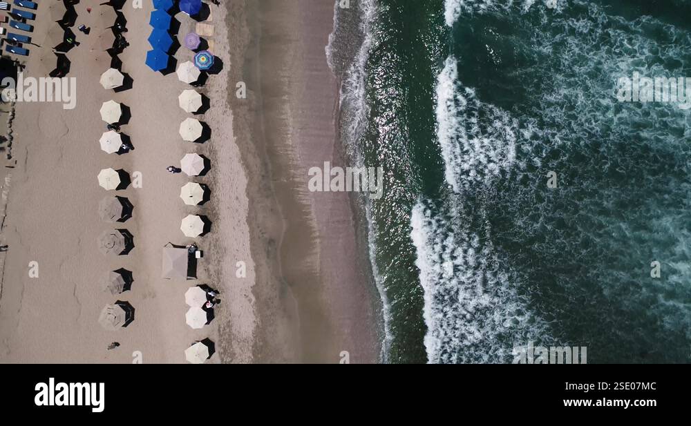 Birds Eye Drone Aerial View of Ocean Waves Breaking on Sandy Beach With ...